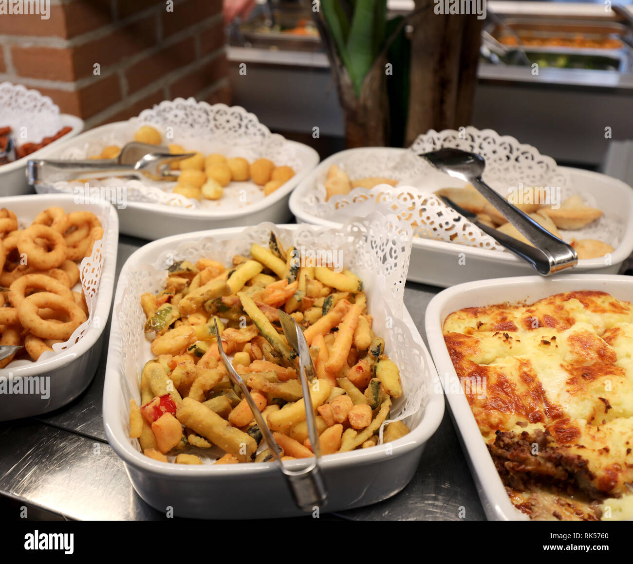 Inside a self service restaurant with many raw and cooked foods Stock ...