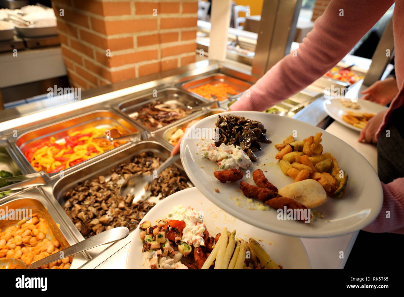 Inside a self service restaurant with many raw and cooked foods Stock ...