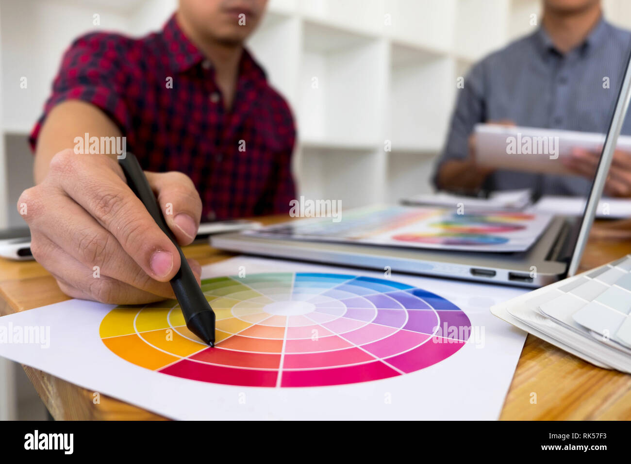 Graphic designers choose colors from the color bands samples for design ...