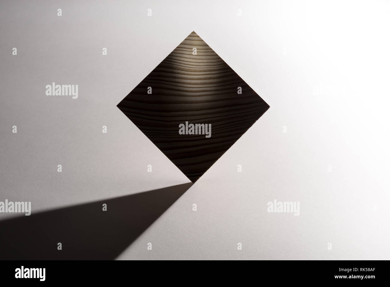 Abstract geometric real wooden cube whit real shadow on gray background ...