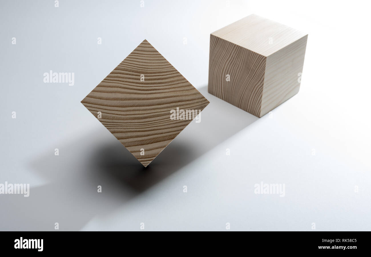 Abstract geometric real wooden cubes on white background and it's not ...