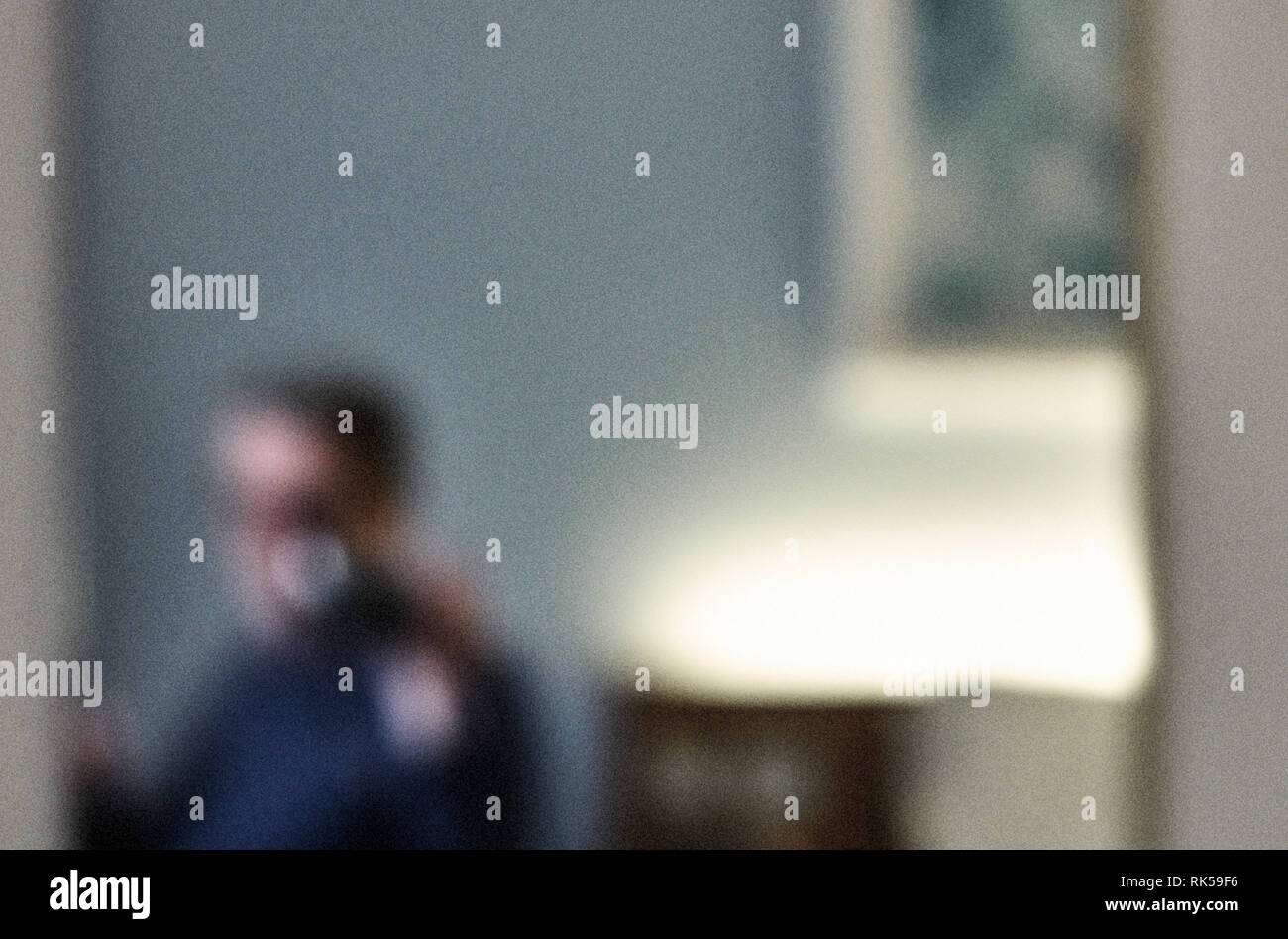Man in hotel room mirror completely blurred with added grain Stock ...