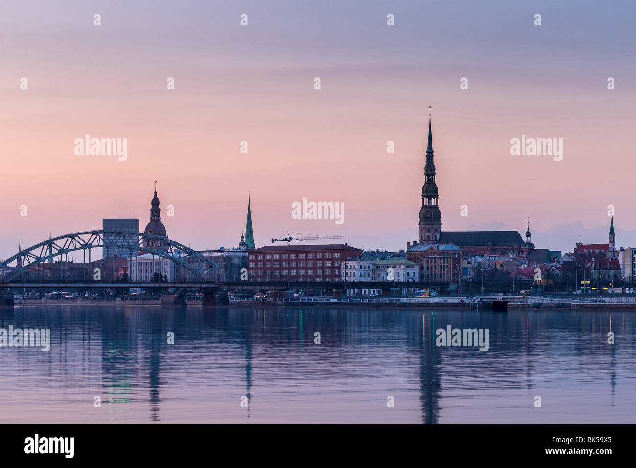 Night view on the illuminated riverside with reflection on the river in ...