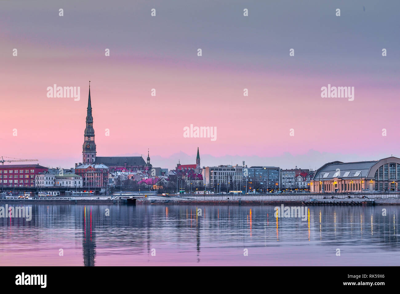 Night view on the illuminated riverside with reflection on the river in ...
