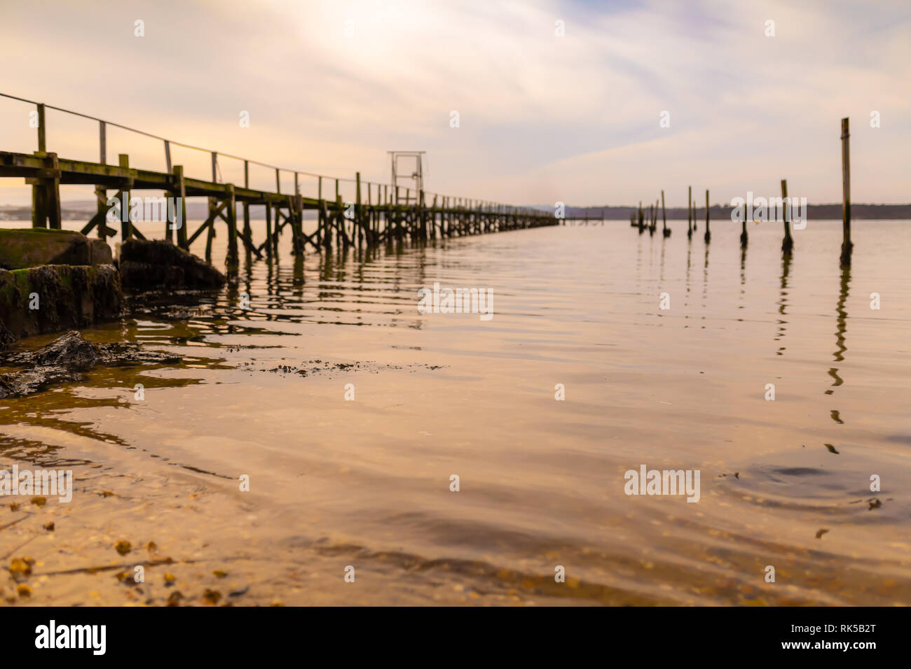 Colour landscape photograph taken from waters edge looking out onto ...