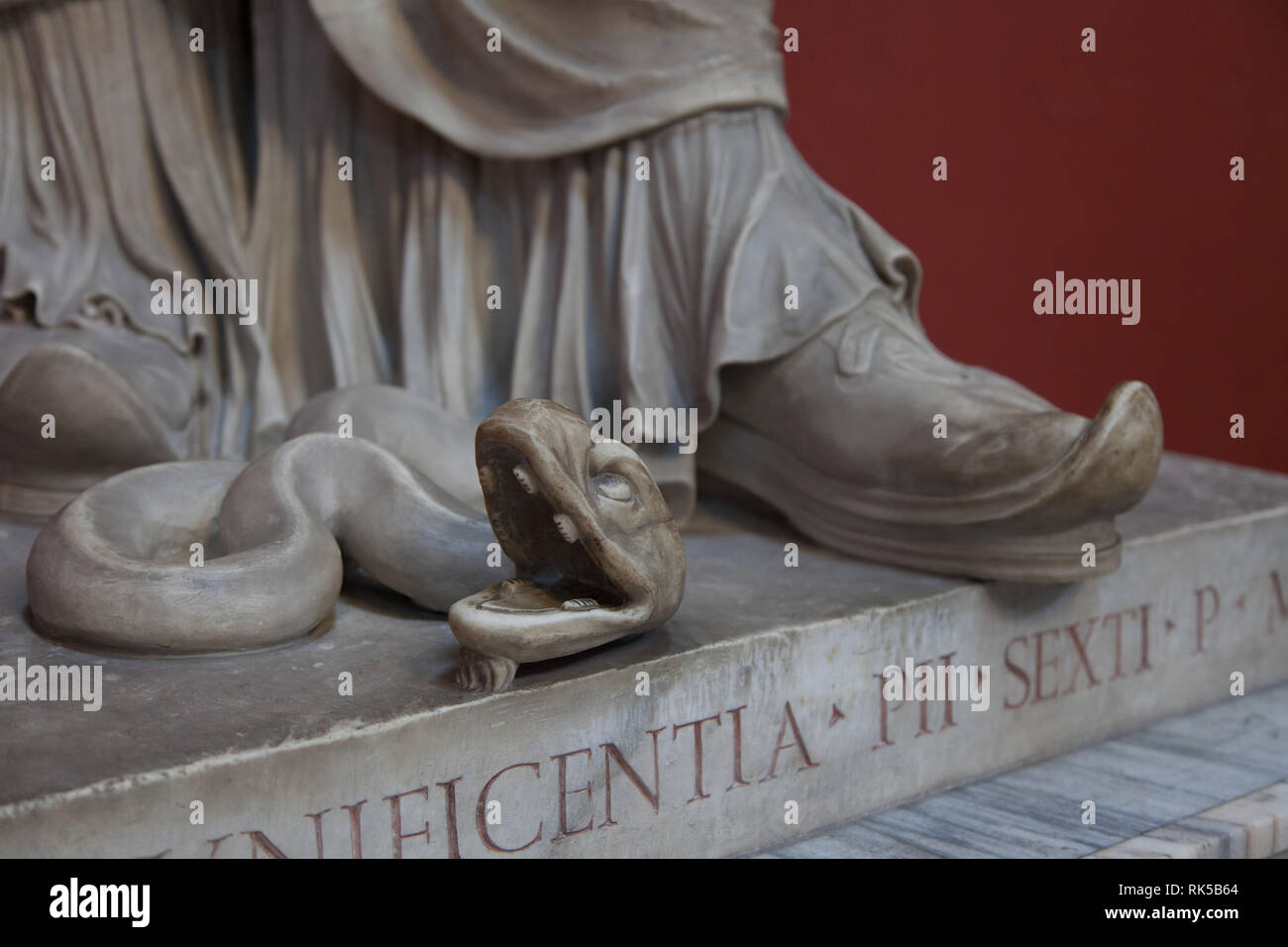 Snake at the foot of sculpture in the Vatican museum in Rome Stock ...
