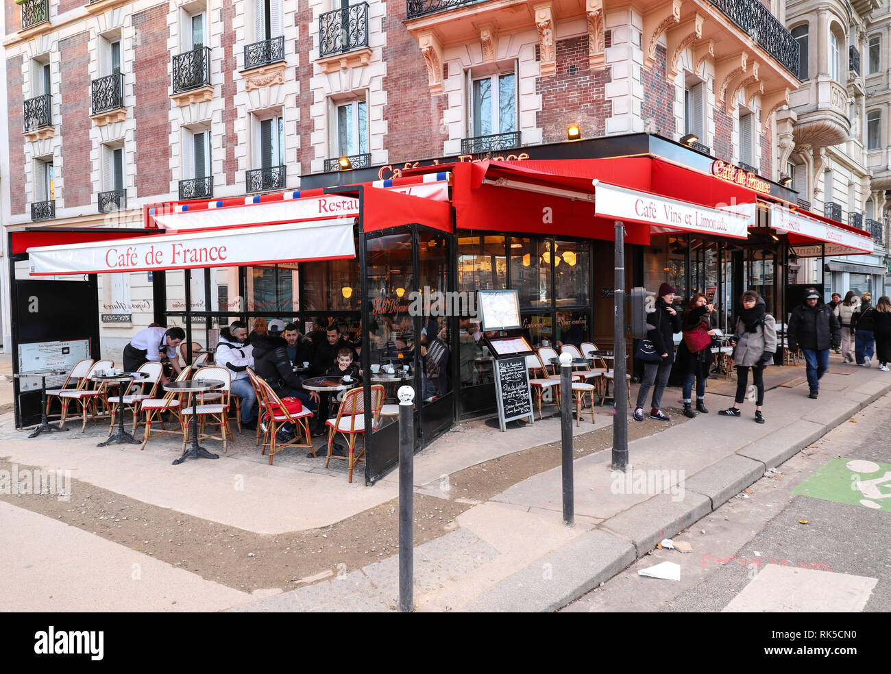 Typical view of the Parisian street cafe de France located near Italy ...