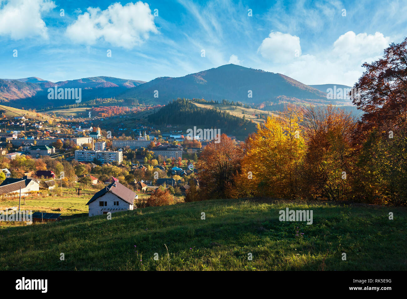 countryside beautiful autumn evening in mountains. small town in the ...