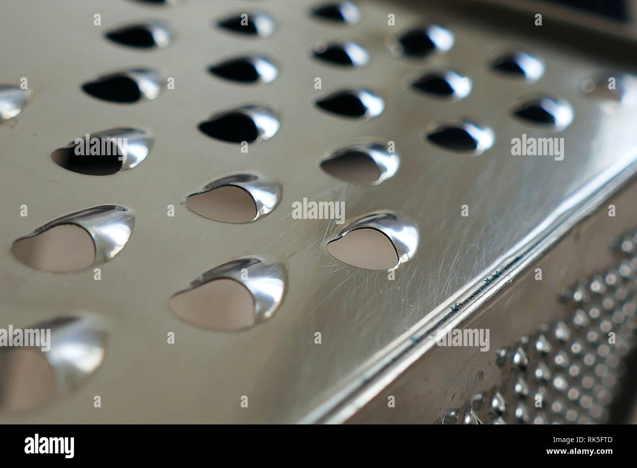 grater blade used in the kitchen Stock Photo - Alamy