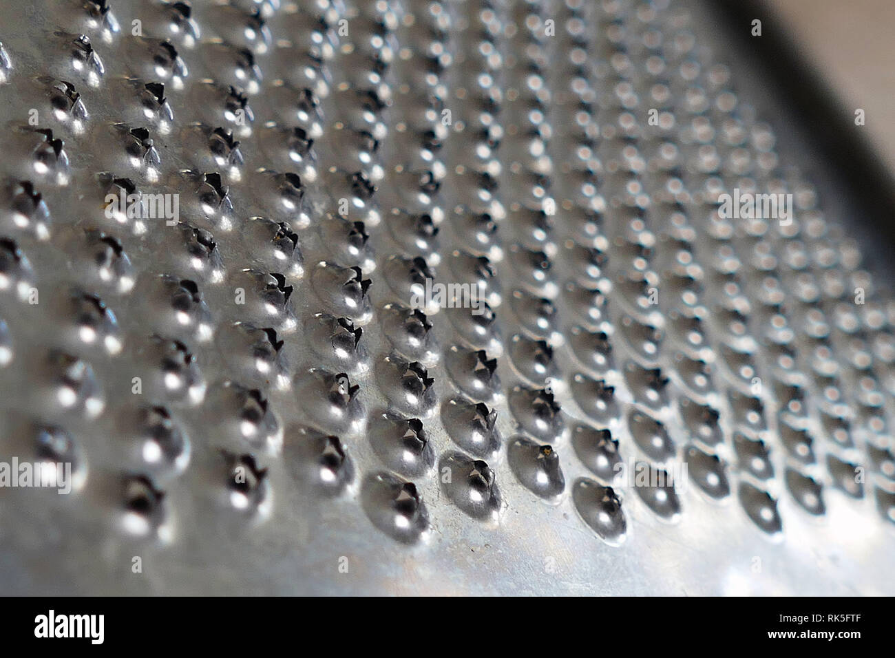 grater blade used in the kitchen Stock Photo - Alamy