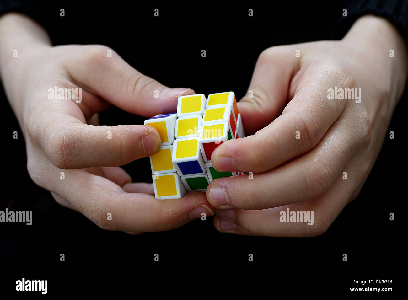 a person trying to equalize the colors of the intelligence cube Stock ...
