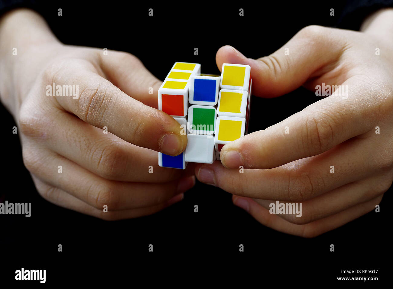 a person trying to equalize the colors of the intelligence cube Stock ...