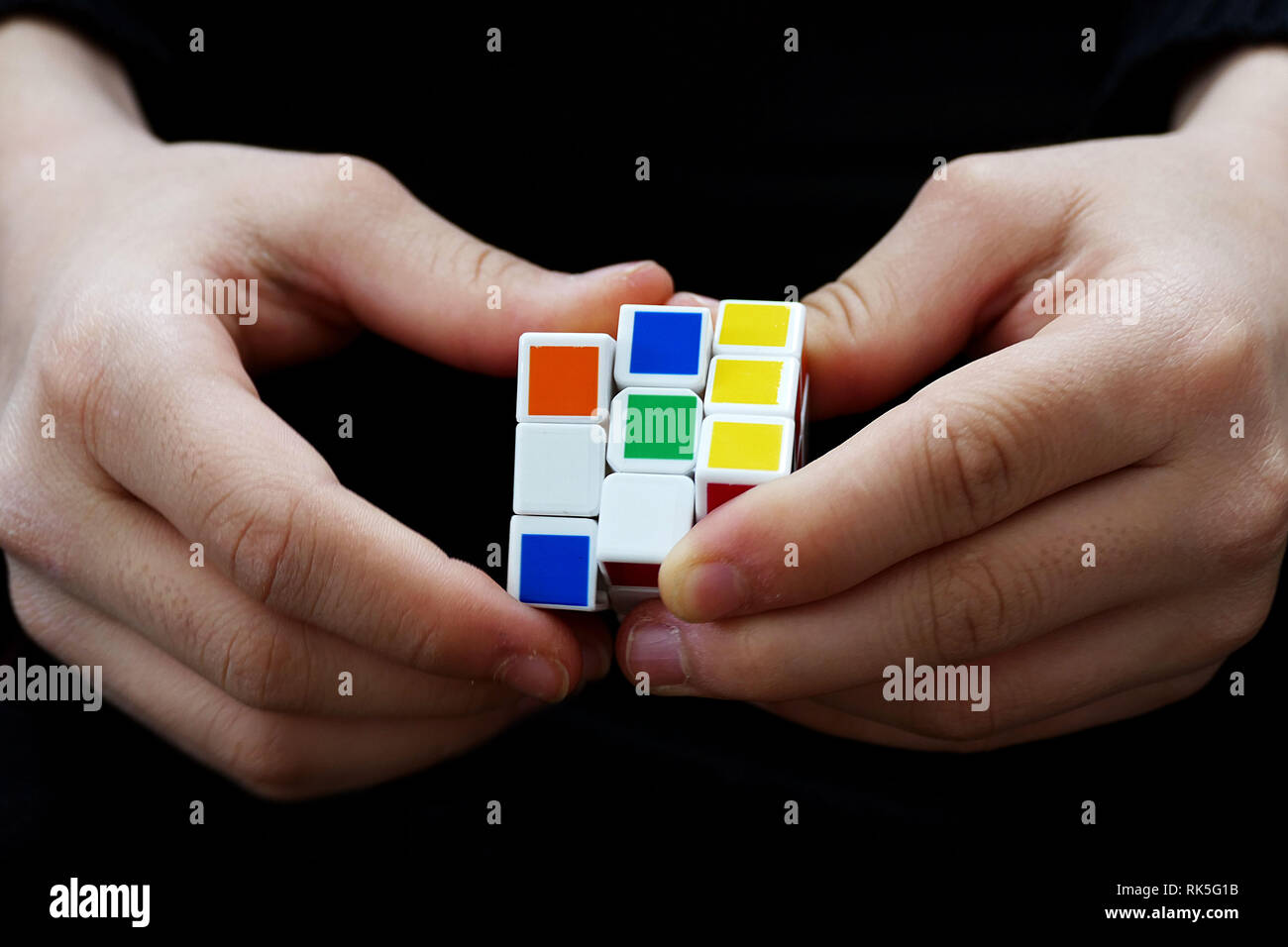 a person trying to equalize the colors of the intelligence cube Stock ...
