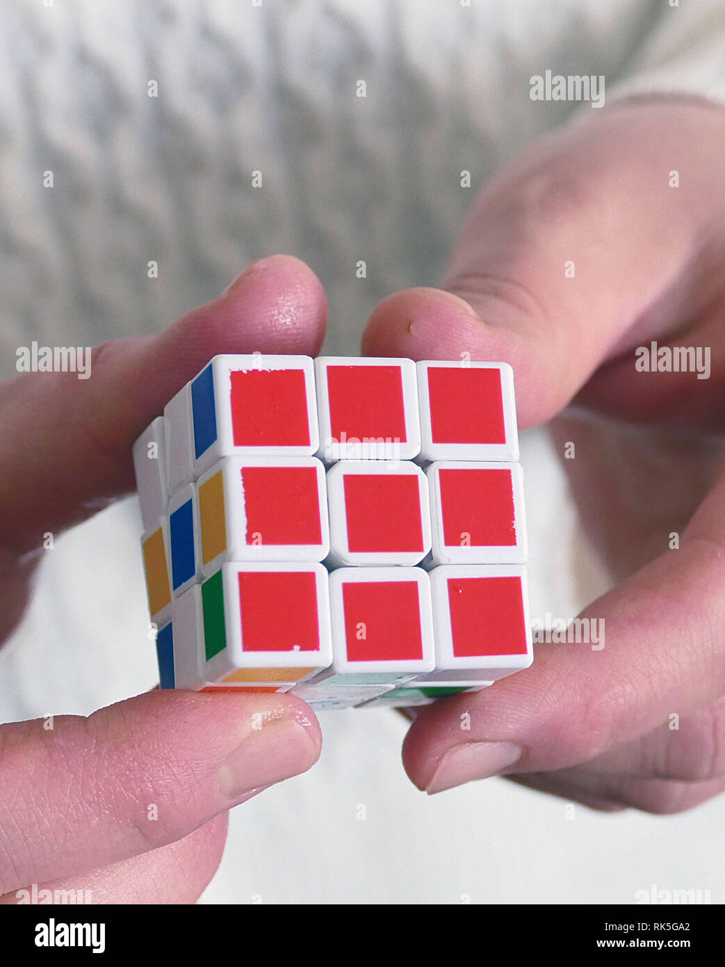 a person trying to equalize the colors of the intelligence cube Stock ...