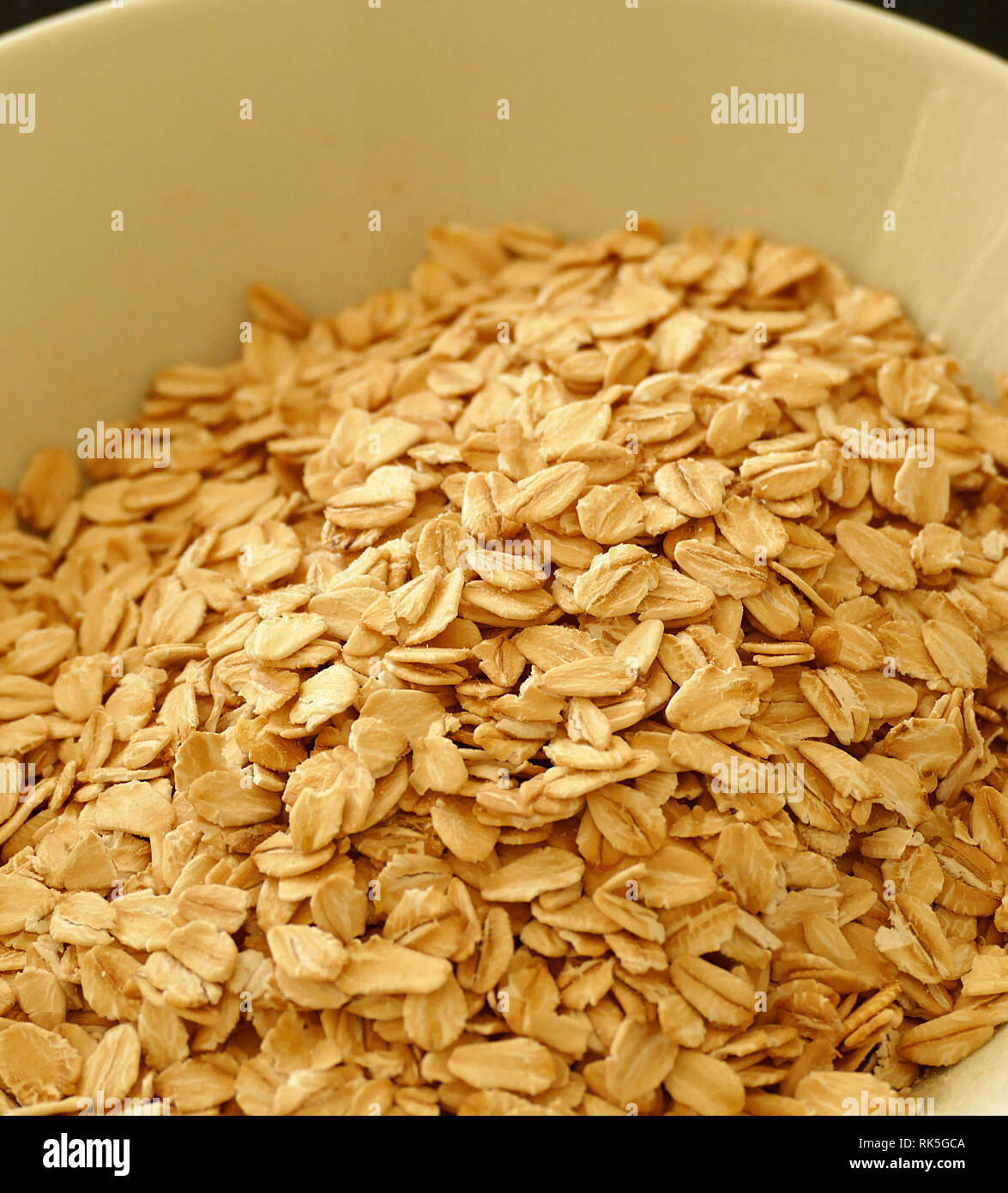 fresh oatmeal, human health and natural oatmeal grains Stock Photo - Alamy