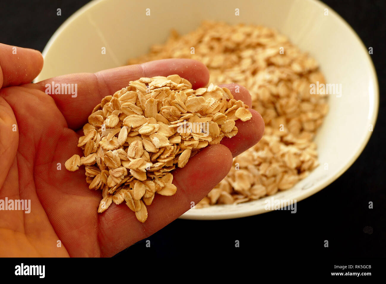 fresh oatmeal, human health and natural oatmeal grains Stock Photo - Alamy