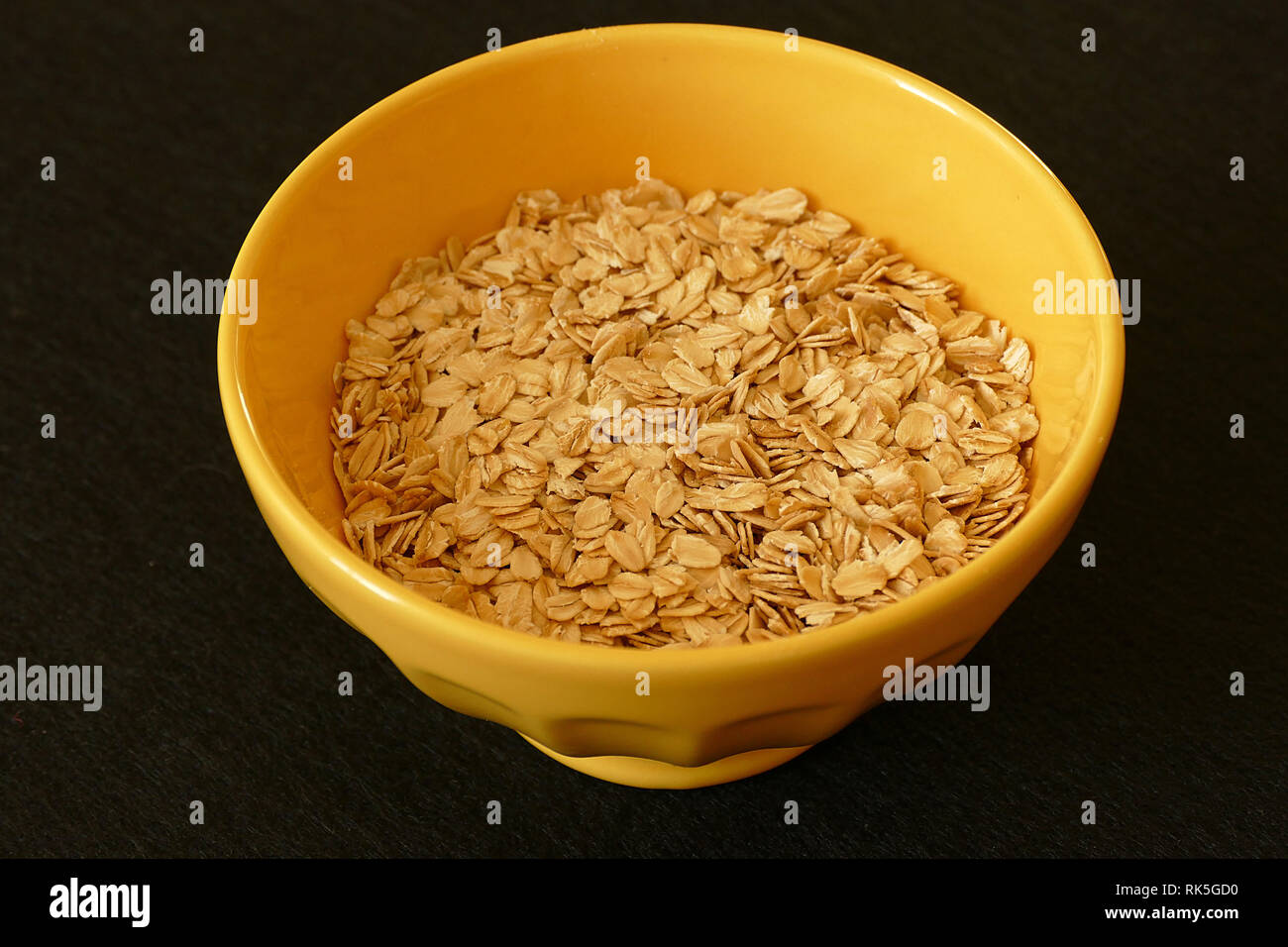 fresh oatmeal, human health and natural oatmeal grains Stock Photo - Alamy