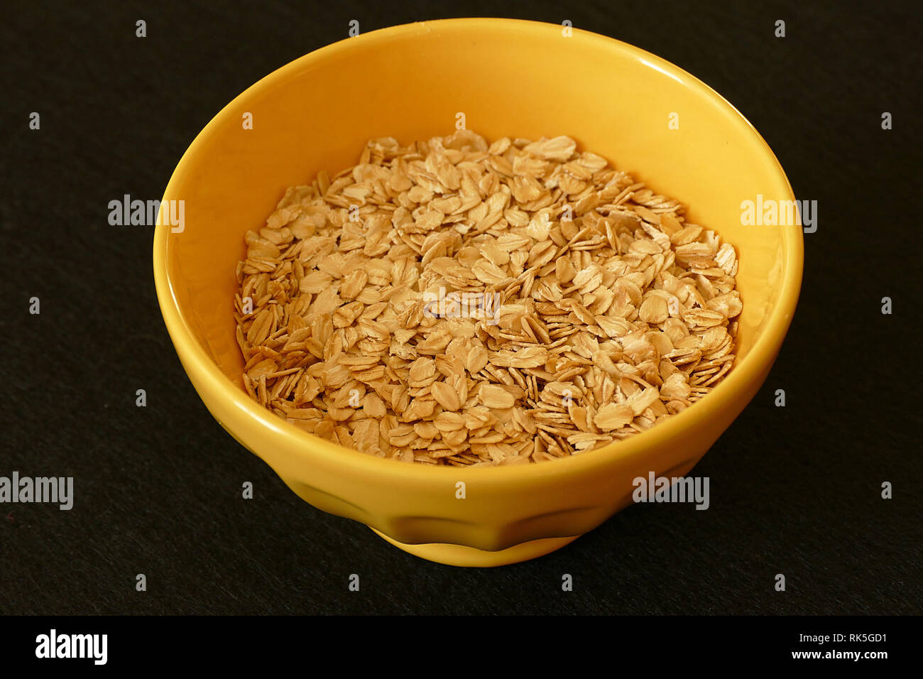 fresh oatmeal, human health and natural oatmeal grains Stock Photo - Alamy