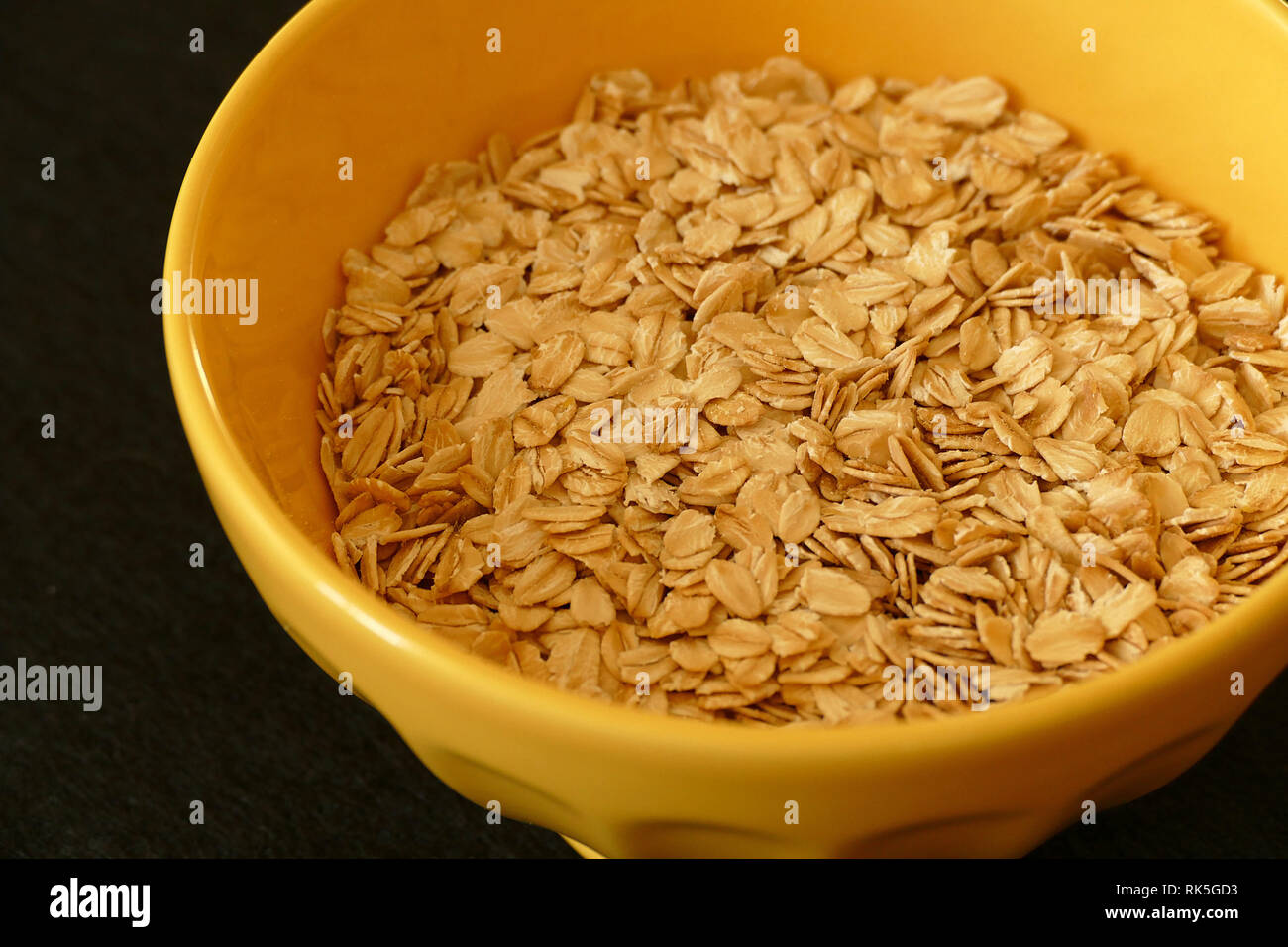 fresh oatmeal, human health and natural oatmeal grains Stock Photo - Alamy