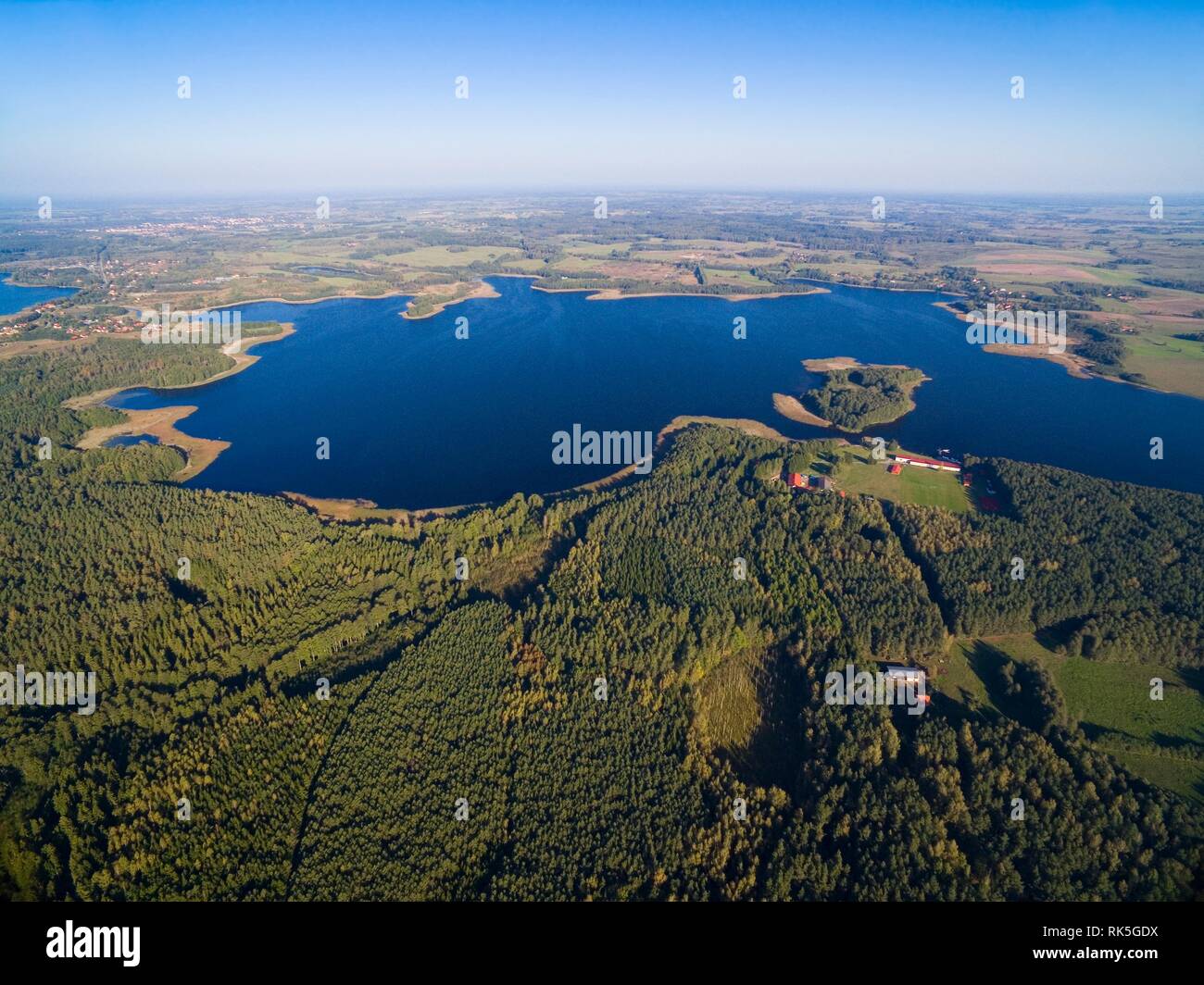Aerial view of beautiful covered with forest landscape of Mazury region ...