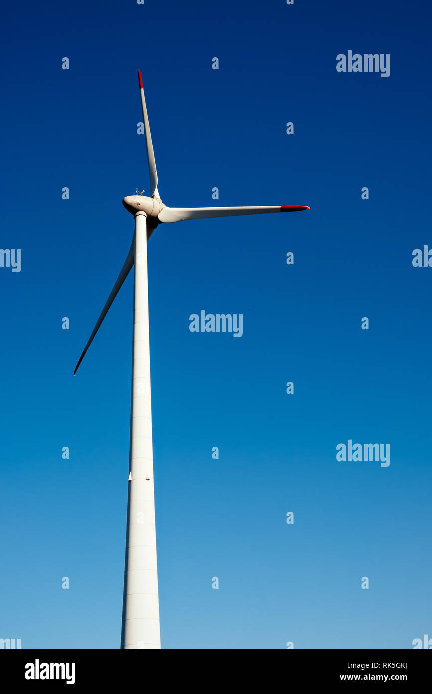 Modern white wind turbines or windmill producing clean energy Stock ...