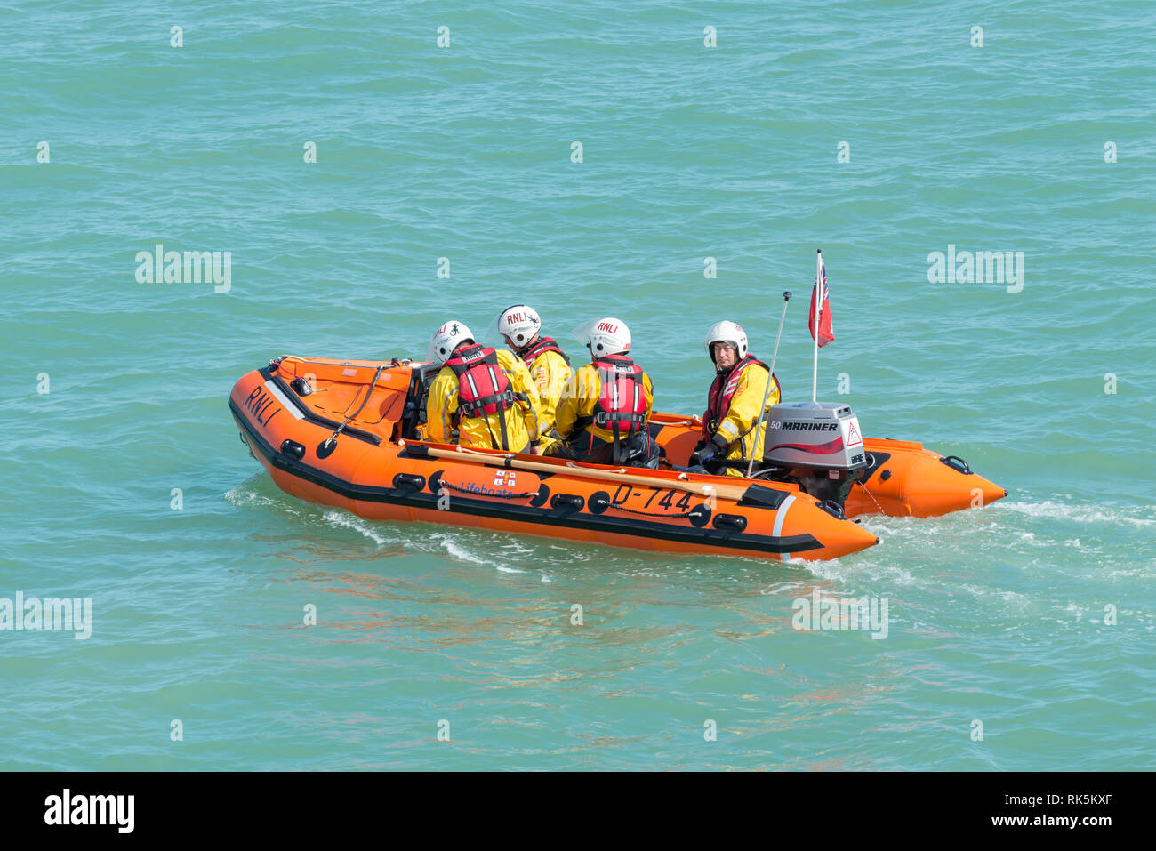 Members of the RNLI, Royal National Lifeboat Institution, patrol the ...