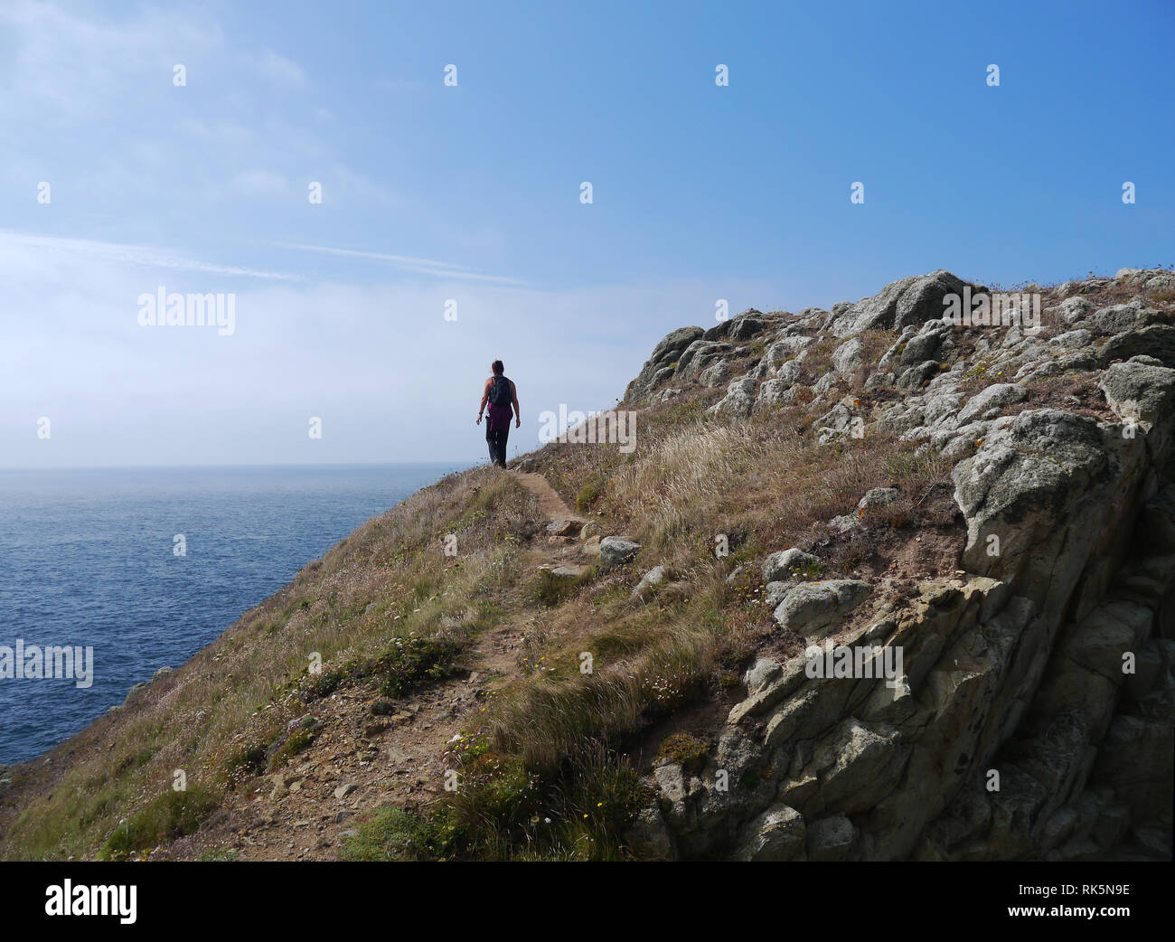 Lone Woman Hiker Walking the Headland near the WW2 German Pleinmont ...
