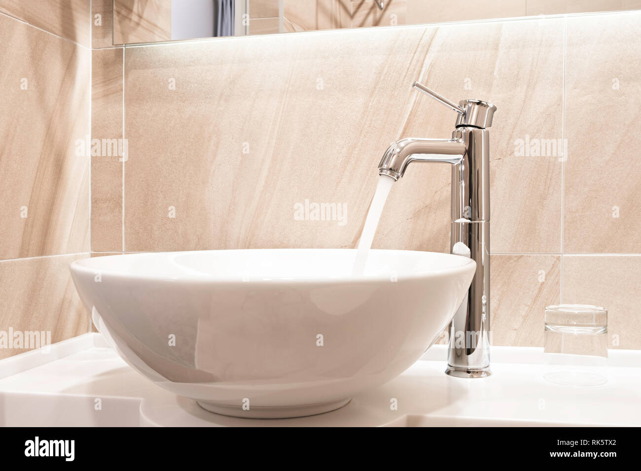 faucet and water flow Stock Photo - Alamy