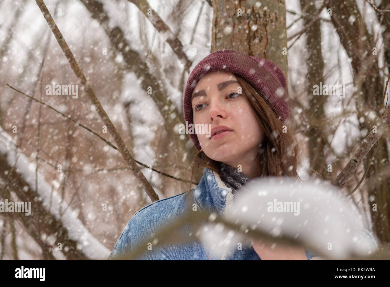 beautiful sad woman relax on winter forest under falling snow Stock ...