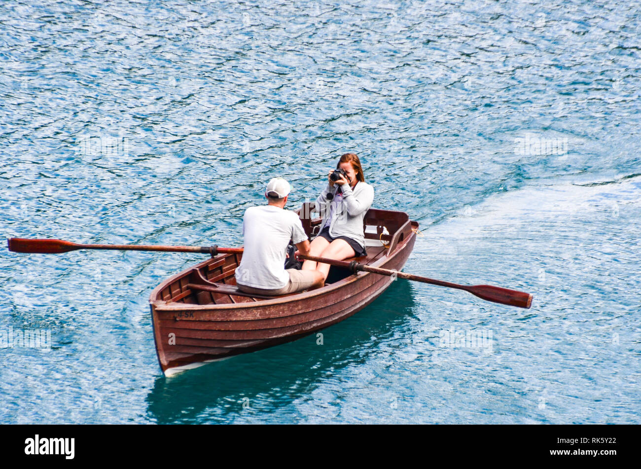 Couple rowing in a boat in the Plitvice Lakes National Park (UNESCO ...