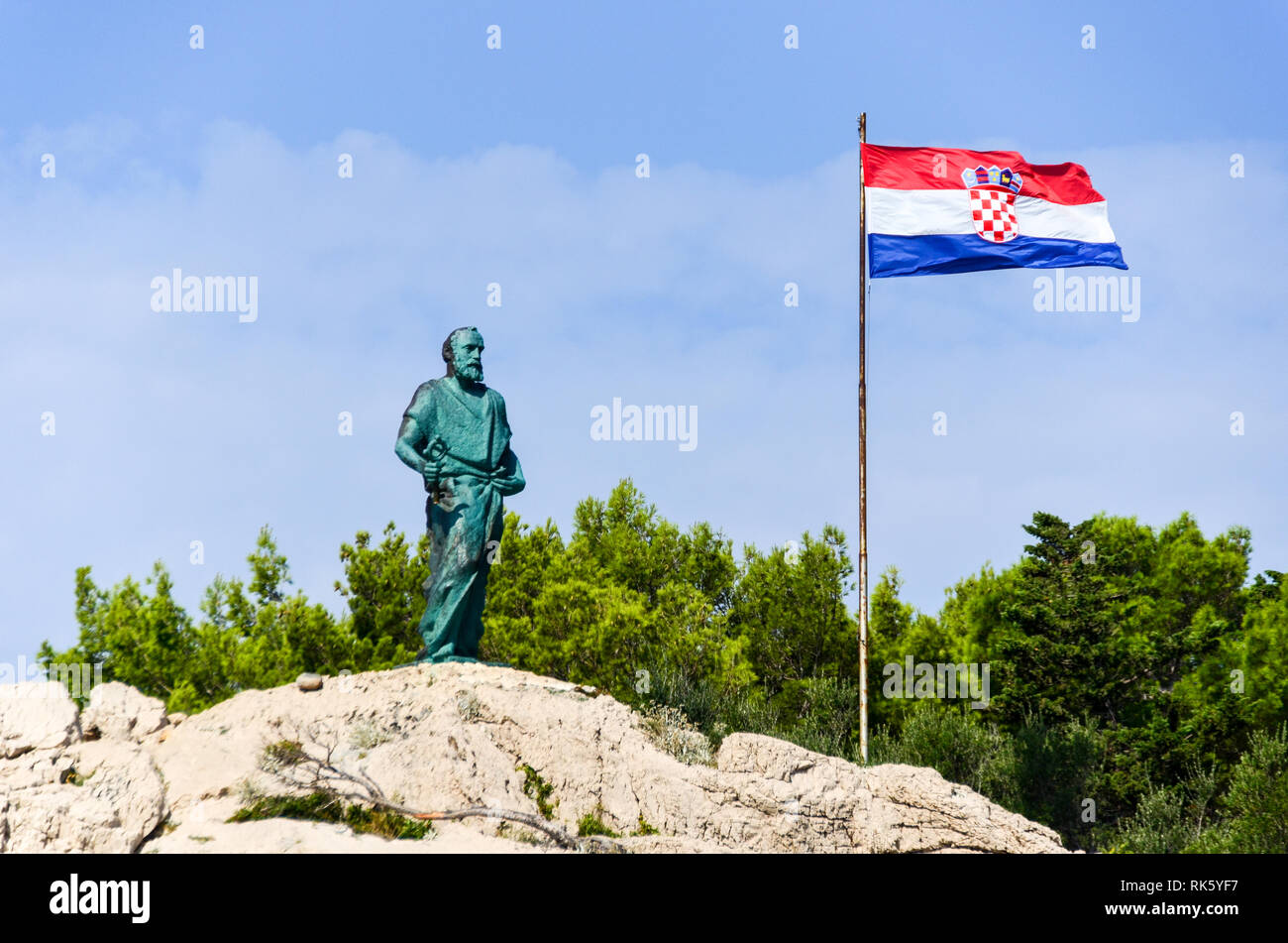 Croatian flag flying above the statue of St. Peter holding a key in ...