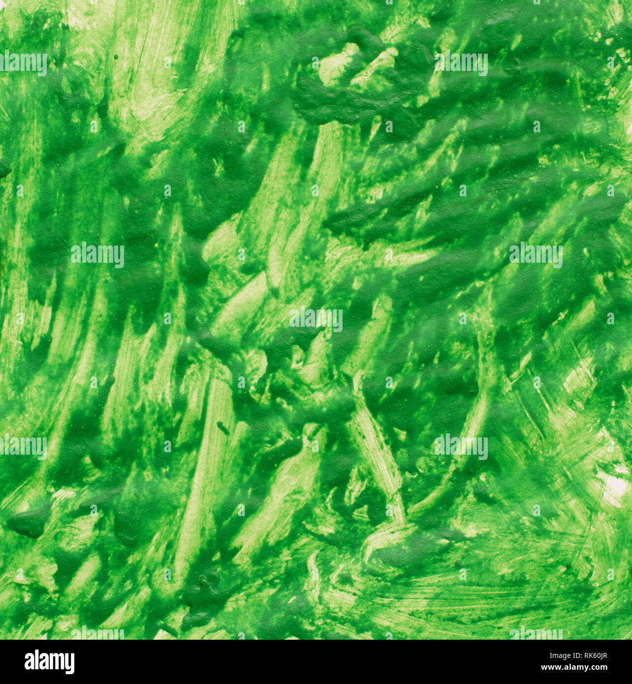 Picture in green color made by children's fingers on paper background ...