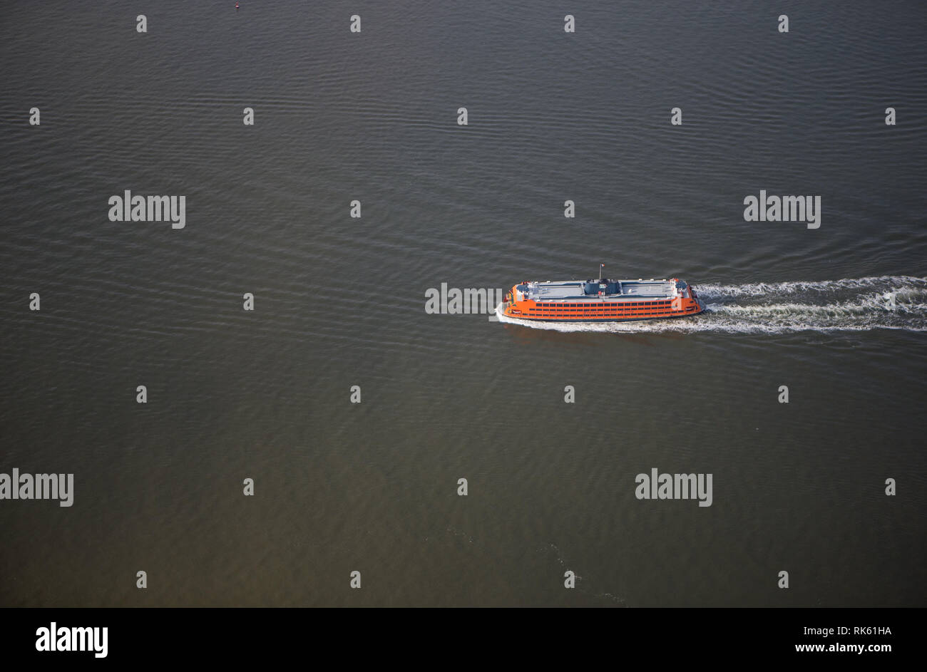 Aerial view of the Staten Island ferry crossing New York Harbor, New ...