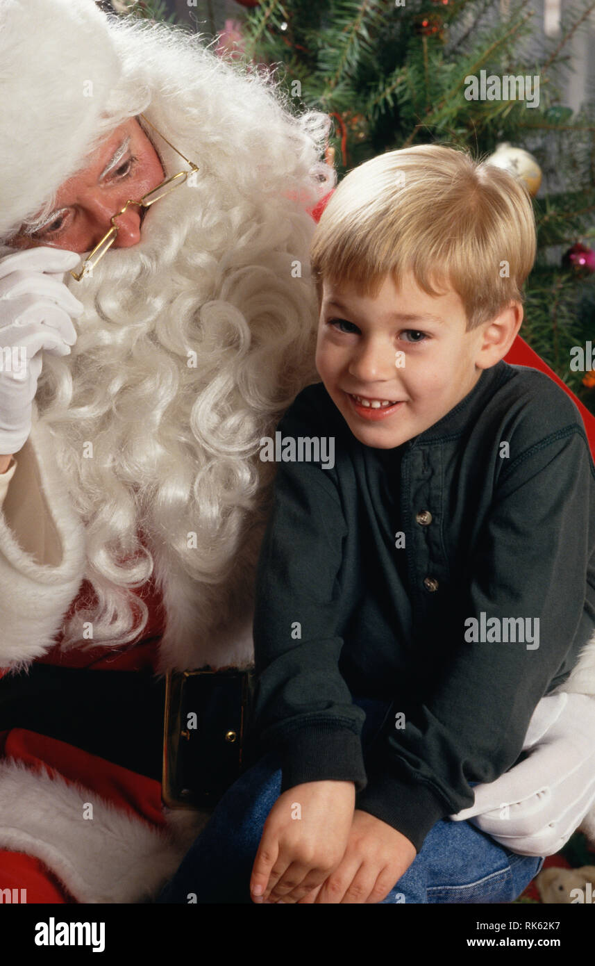 Little Boy on Santa's Lap, Christmas time, USA Stock Photo - Alamy