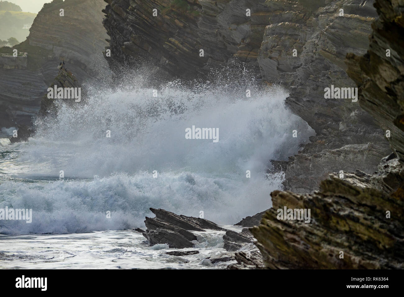 Sea waves breaking in the coast cliffs in Barrika, Basque Country Stock ...