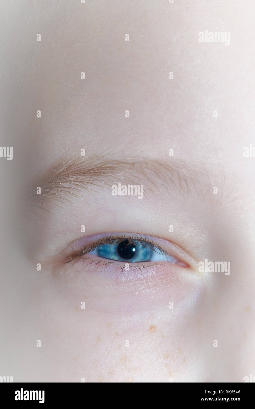 Baby blue beautiful, brooding eyes of a boy Stock Photo - Alamy