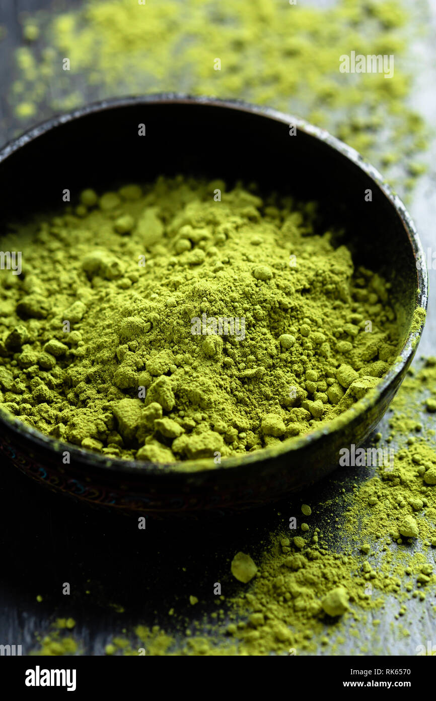 Directly above shot of matcha tea powder on table Stock Photo - Alamy