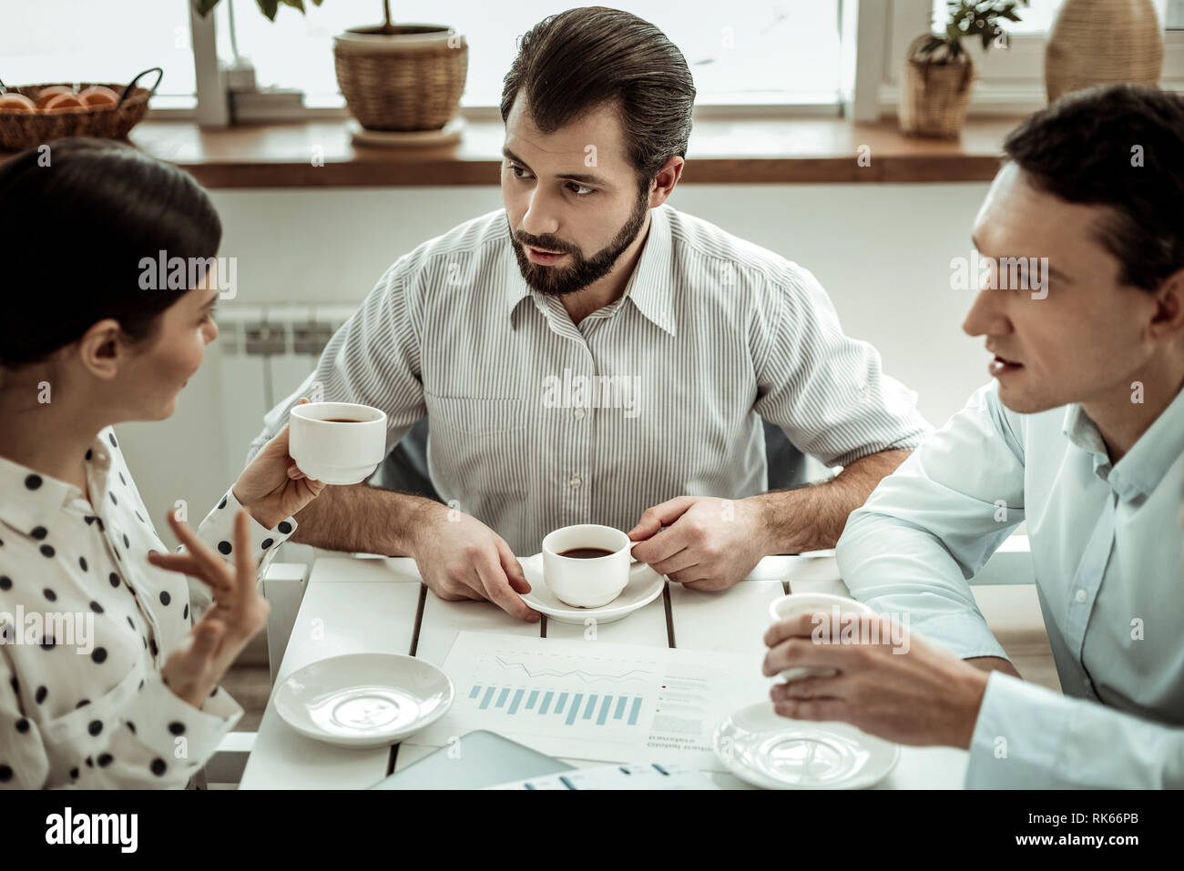 Close up of friendly colleagues that discussing their idea Stock Photo ...