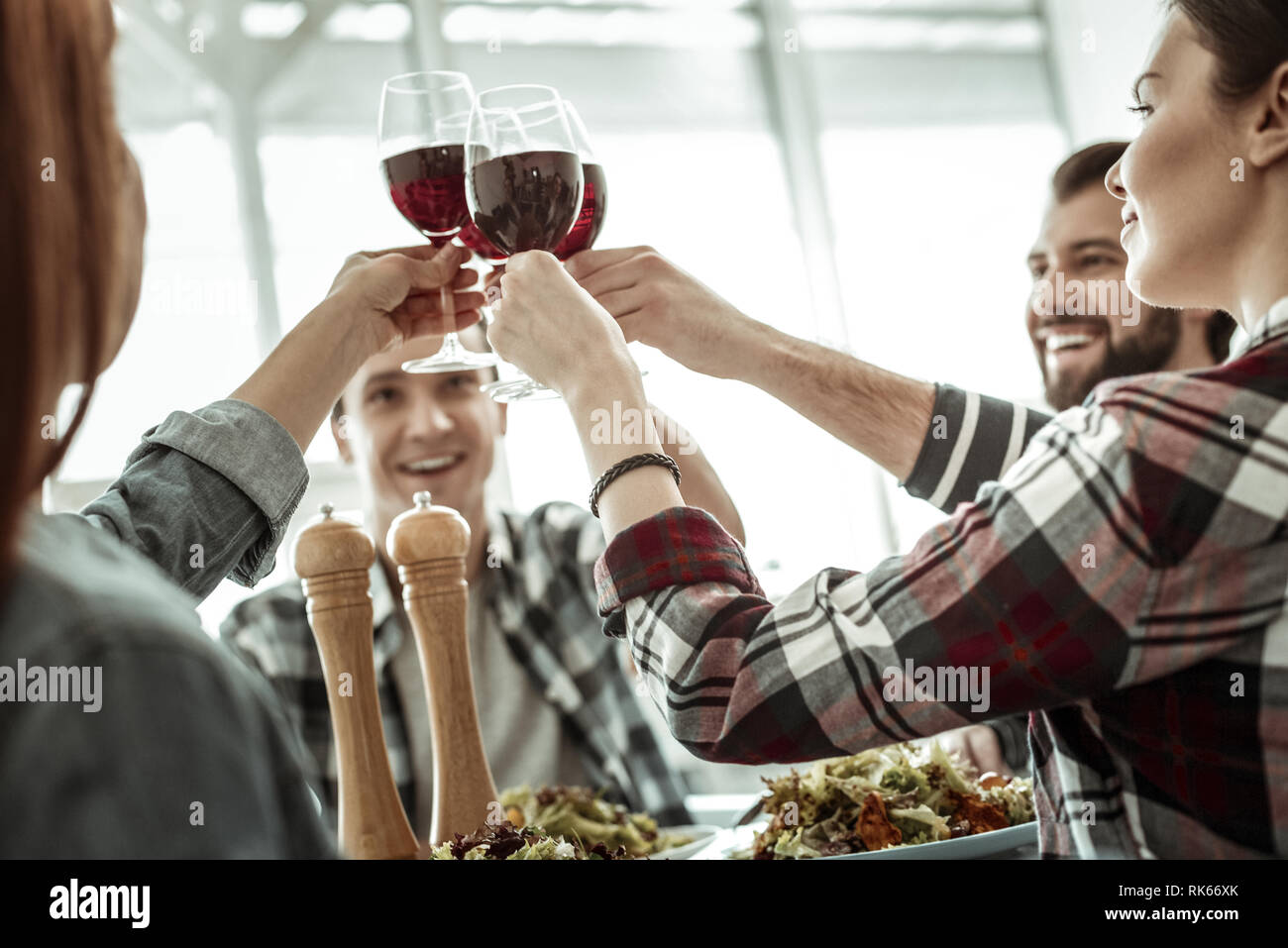 Positive delighted young people celebrating their success Stock Photo ...