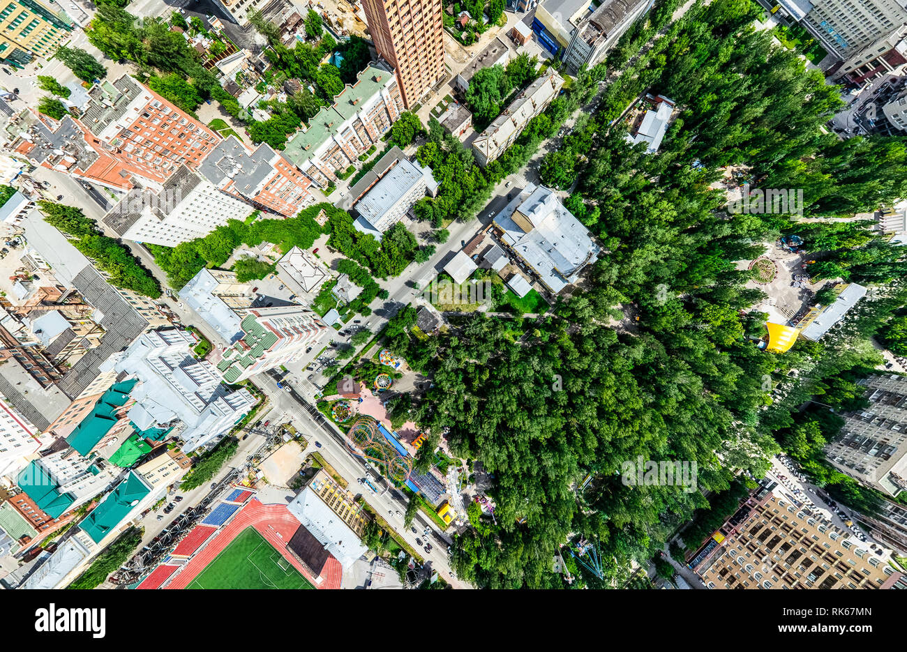 Aerial city view with crossroads and roads, houses, buildings, parks ...