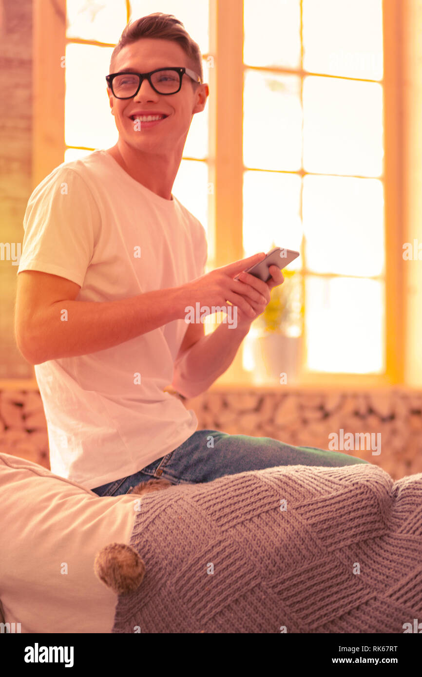 Happy positive guy averting from typing message Stock Photo - Alamy Happy positive guy averting from typing message Stock Photo - Alamy