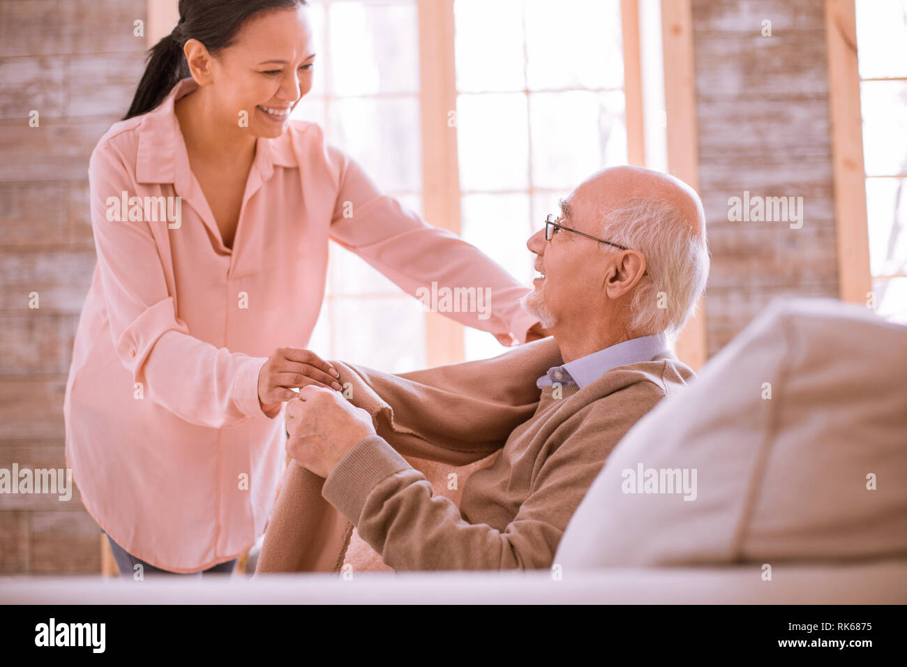 Female volunteer helping senior woman hi-res stock photography and ...