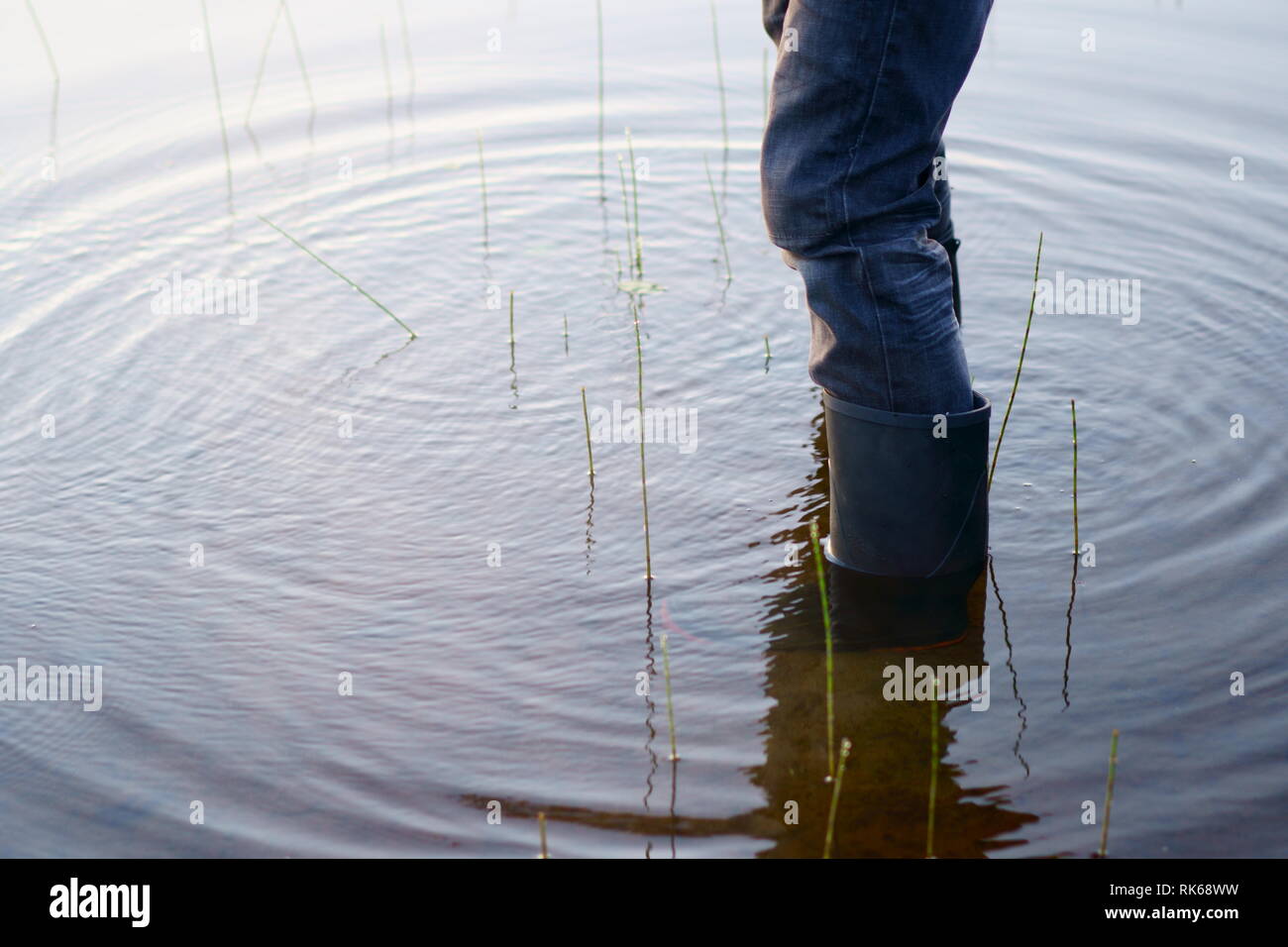 Man in rubber boots hi-res stock photography and images - Alamy