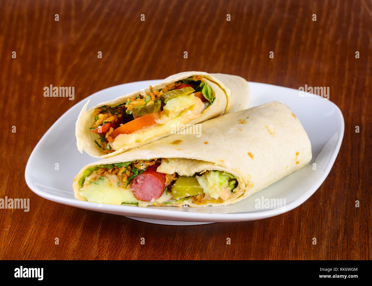 Tortilia with saucage and cucumber Stock Photo - Alamy