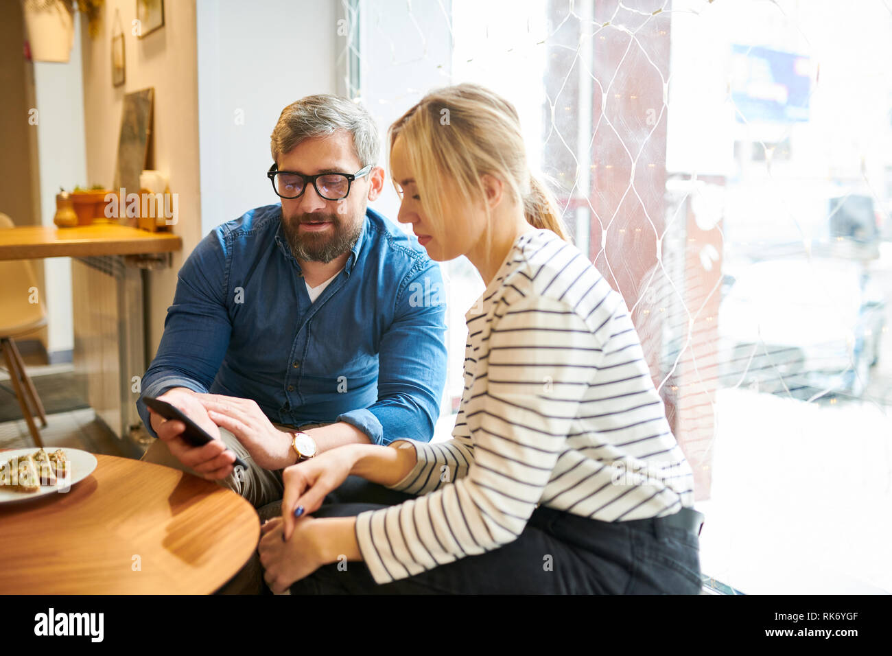 Watching video in smartphone Stock Photo - Alamy