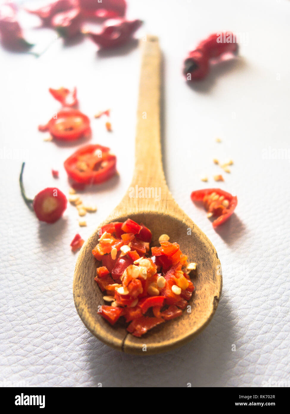 Macro Chopped Red Chili Peppers in Wooden Spoon 2 Stock Photo - Alamy