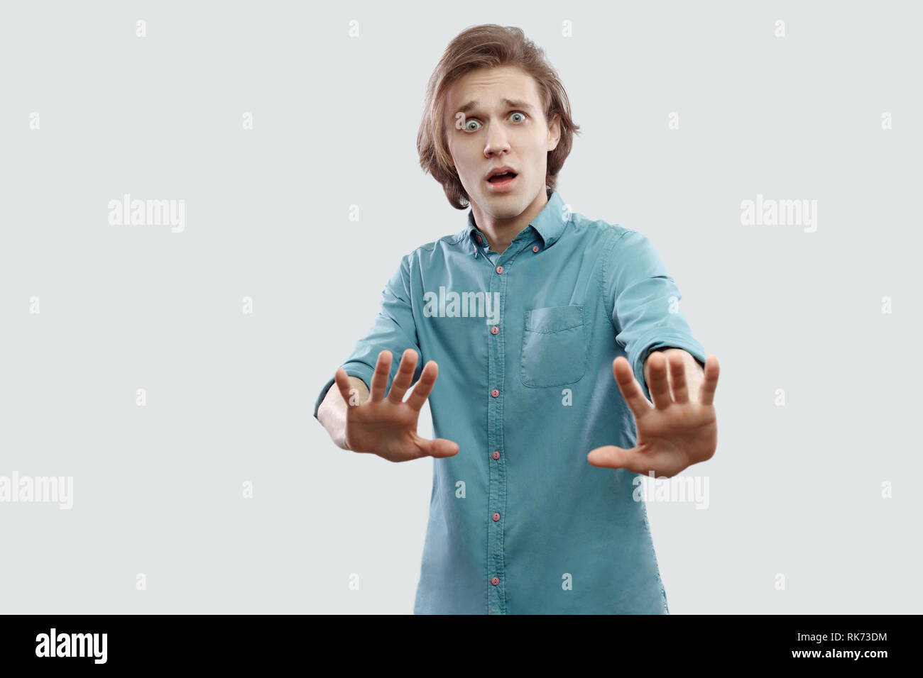 Businessman blocking camera hand hi-res stock photography and images ...