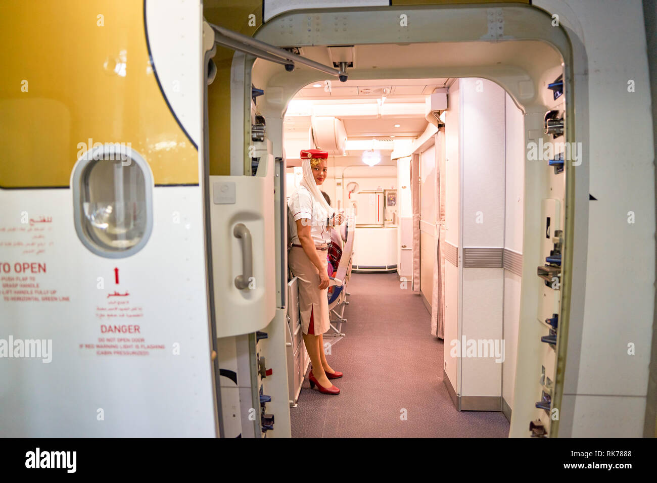 DUBAI, UAE - CIRCA APRIL, 2016: Emirates crew member meet passengers on ...