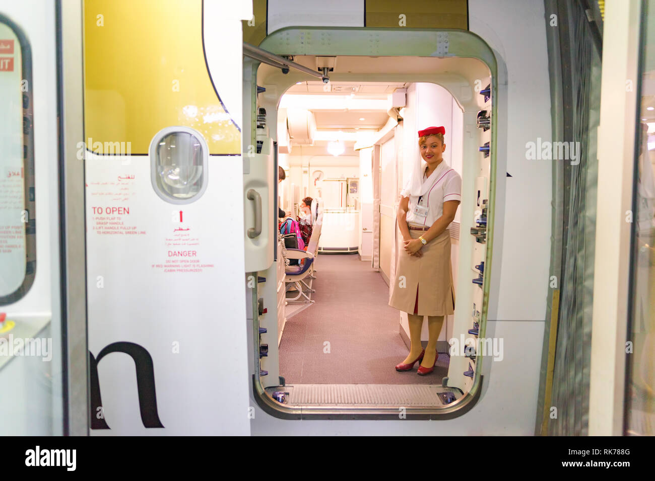DUBAI, UAE - CIRCA APRIL, 2016: Emirates crew member meet passengers on ...