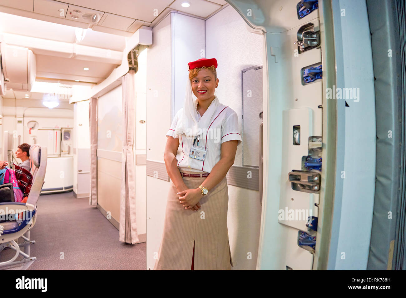 DUBAI, UAE - CIRCA APRIL, 2016: Emirates crew member meet passengers on ...